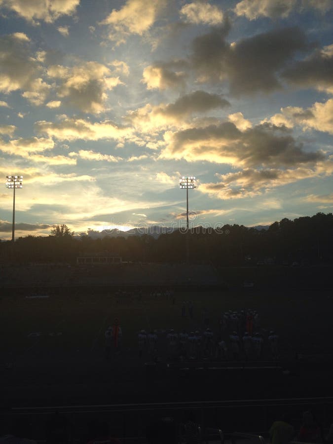 Clouds and Sunset Over the Football Field Stock Photo - Image of game ...
