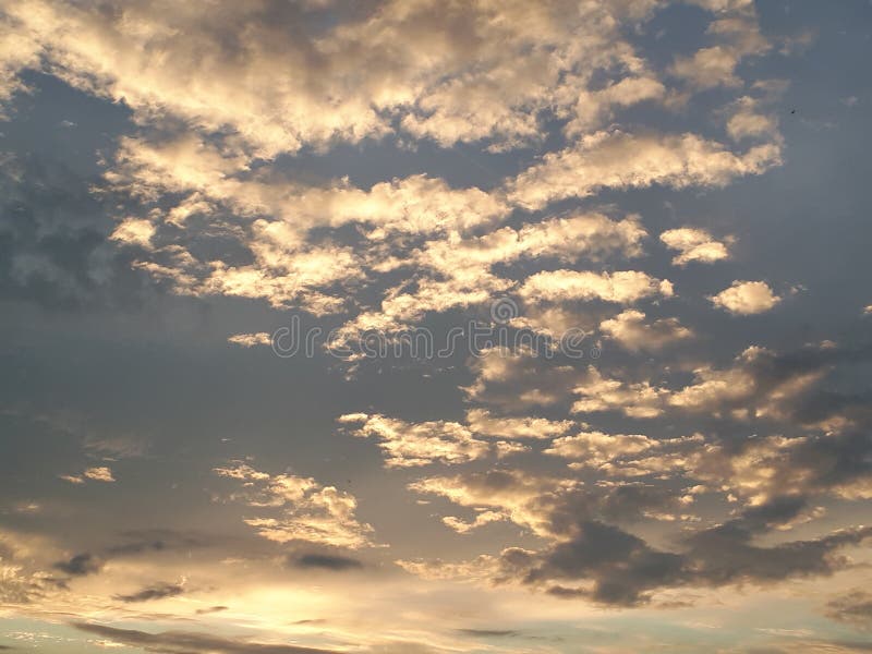 Sunlit Clouds stock photo. Image of orange, clouds, sunlit - 100611914