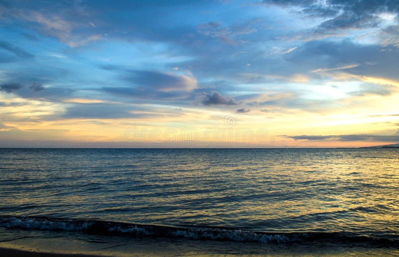 Clouds and Sunsets on the Beach Stock Photo - Image of coastline ...