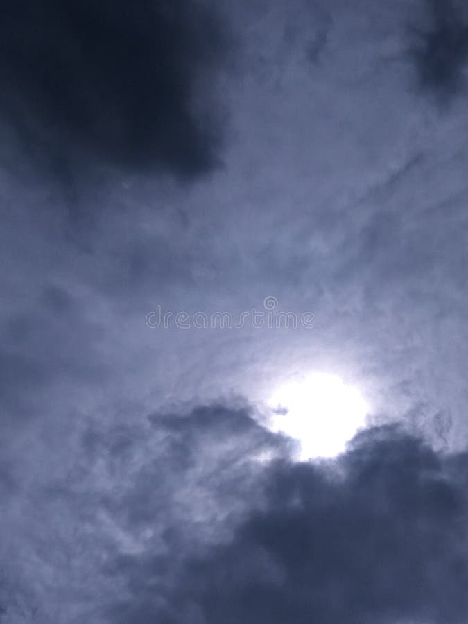 Clouds are Swallowing the Sun Stock Photo - Image of swallowing, stome ...