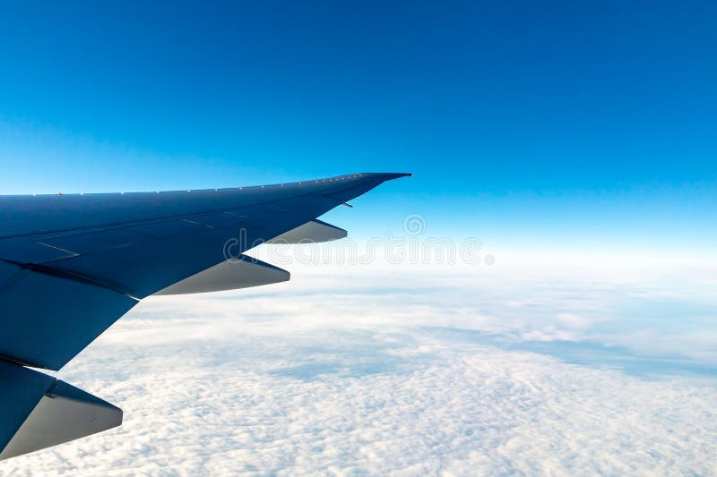 Clouds Under the Wing of an Airplane. Amazing View from the Window of ...
