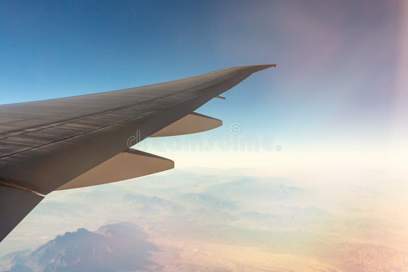 Clouds Under the Wing of an Airplane. Amazing View from the Window of ...