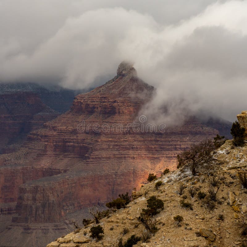 Clouds Wrap Around the Pyramids in Grand Canyon Stock Photo - Image of ...