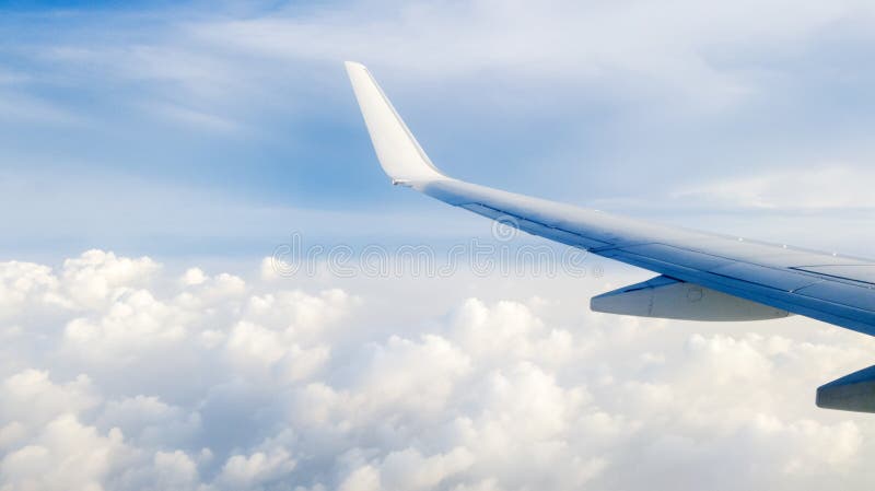 Cloudscape with Airplane Wing Stock Image - Image of blue, aerial ...