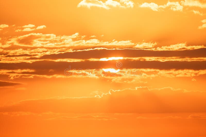 Cloudscape and Dramatic Orange Sky with Rising Sun Behind Clouds ...