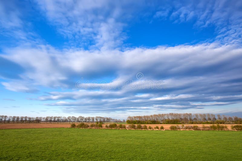 Cloudscape Over Spring Meadow Stock Photo - Image of outdoors, outside ...