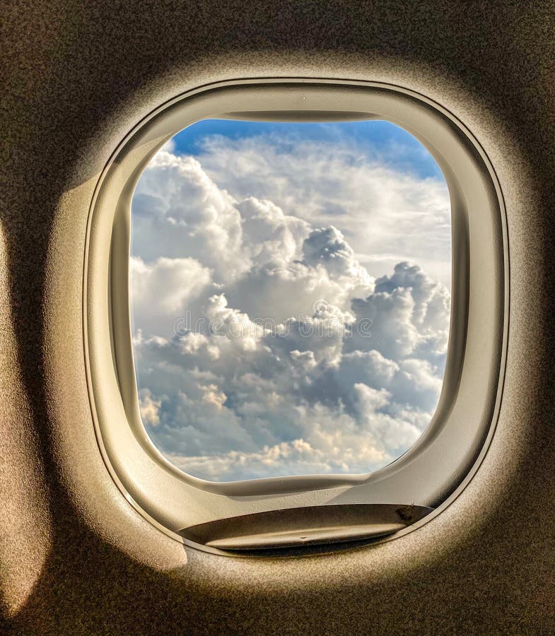 Cloudscape through an Airplane Window Flying Stock Image - Image of ...