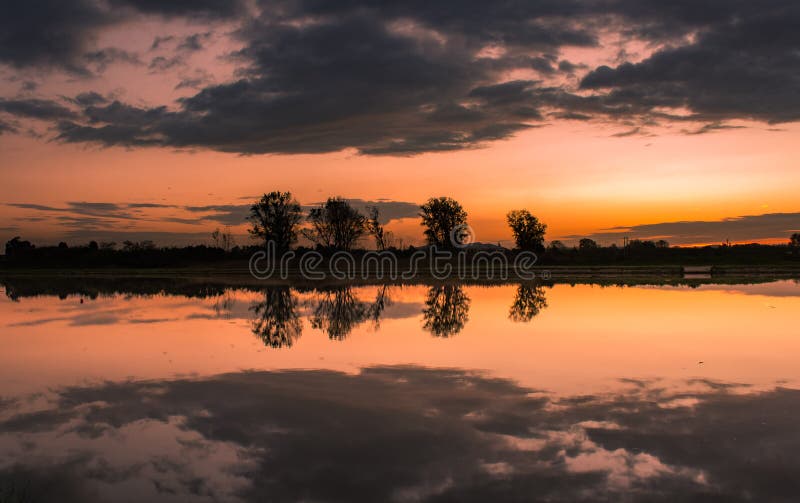 Reflecitons of a Glass Sunset Stock Image - Image of outdoor, lake ...