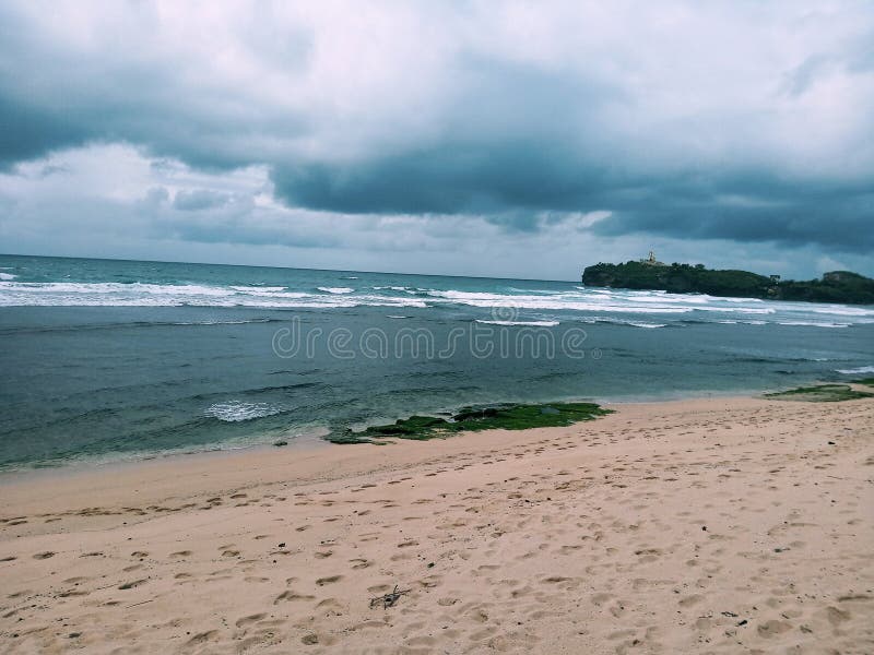 Cloudy beach calm waves stock image. Image of calm, cloudy - 287947511