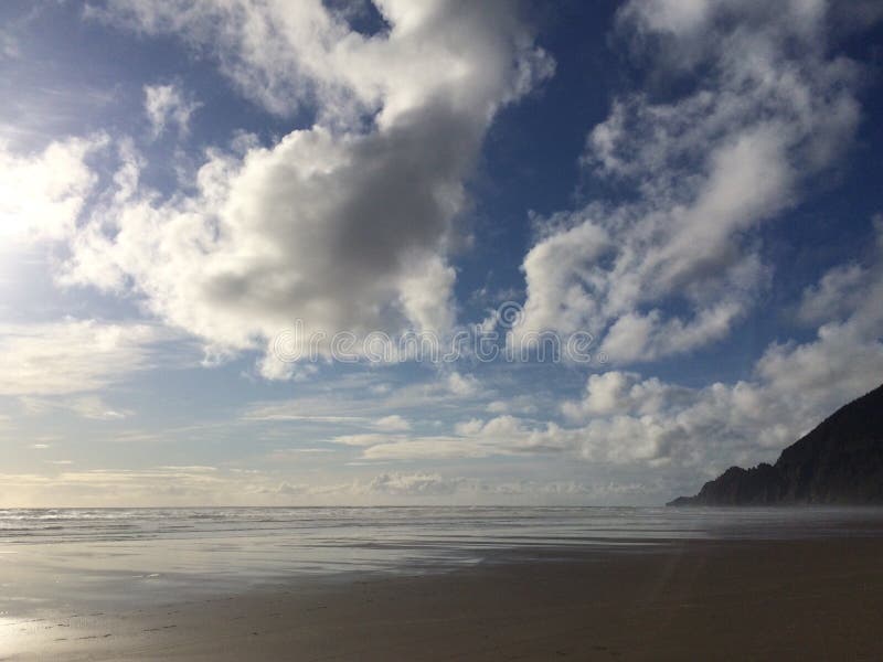 Cloudy beach stock photo. Image of mountain, aquatic - 91353650