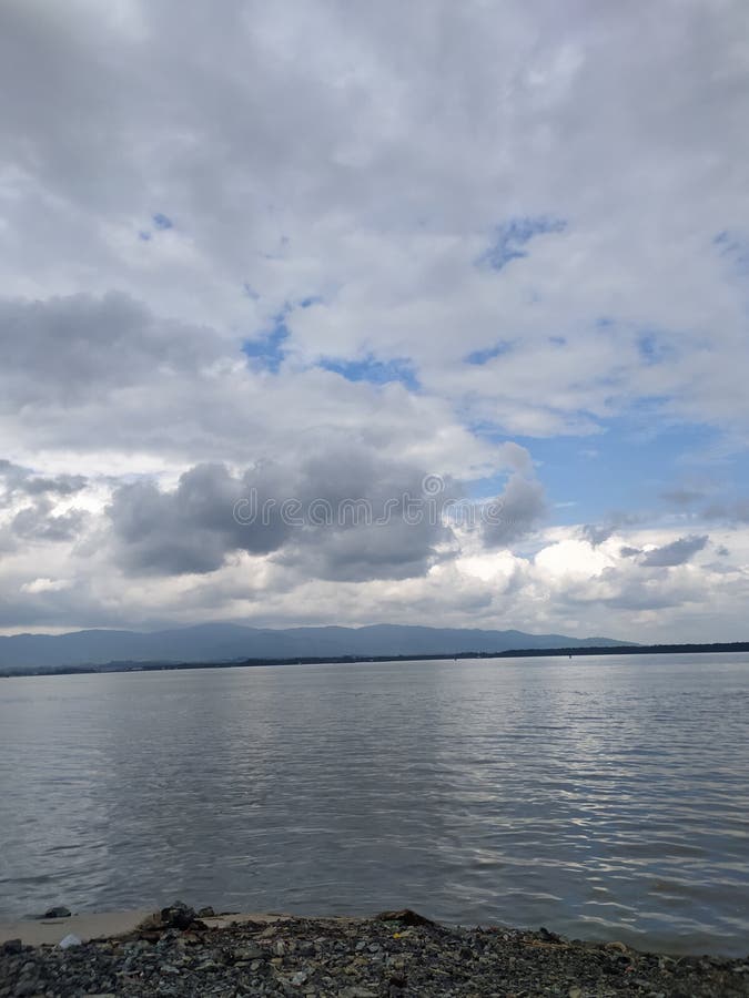 Cloudy Beach during the Day Stock Photo - Image of wonderful, beach: 265097240