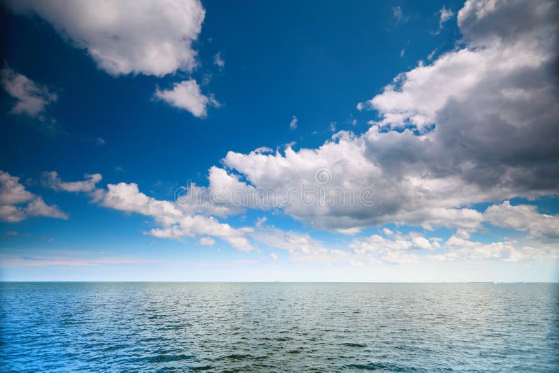 Cloudy Blue Sky Above a Surface of the Sea Stock Image - Image of ...