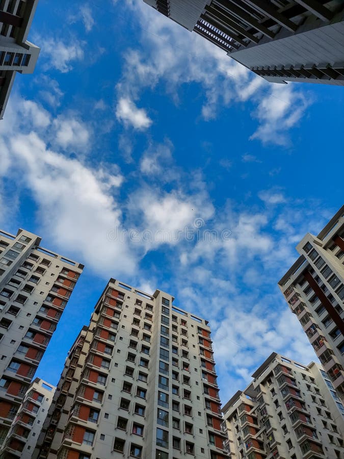 Cloudy Blue Sky in the Gap of High Raise Building Stock Image - Image ...