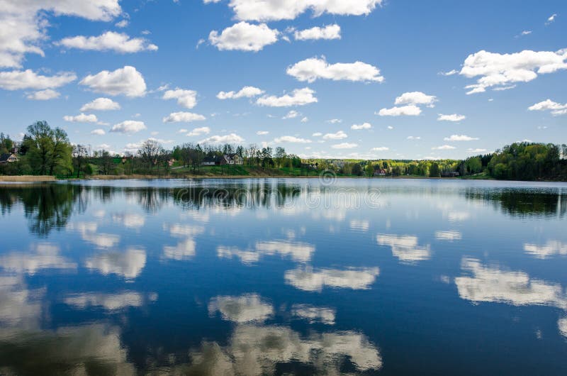 Cloudy Blue Sky Reflects into the Lake. Stock Photo - Image of calm ...