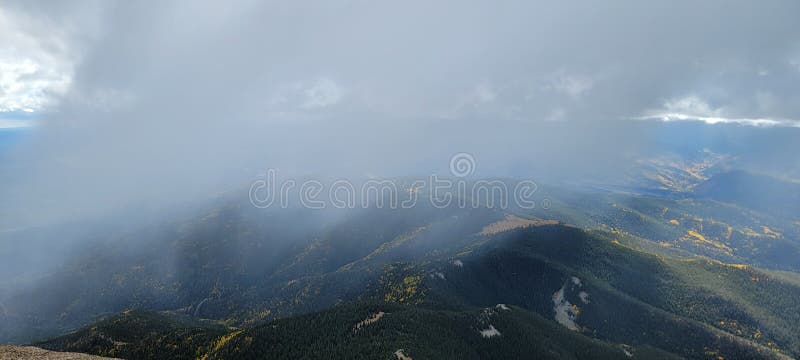 Cloudy Colorado Mountains stock image. Image of spanish - 232108277