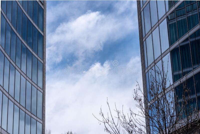 Cloudy Corner of the Sky between Skyscrapers with Reflective Windows ...