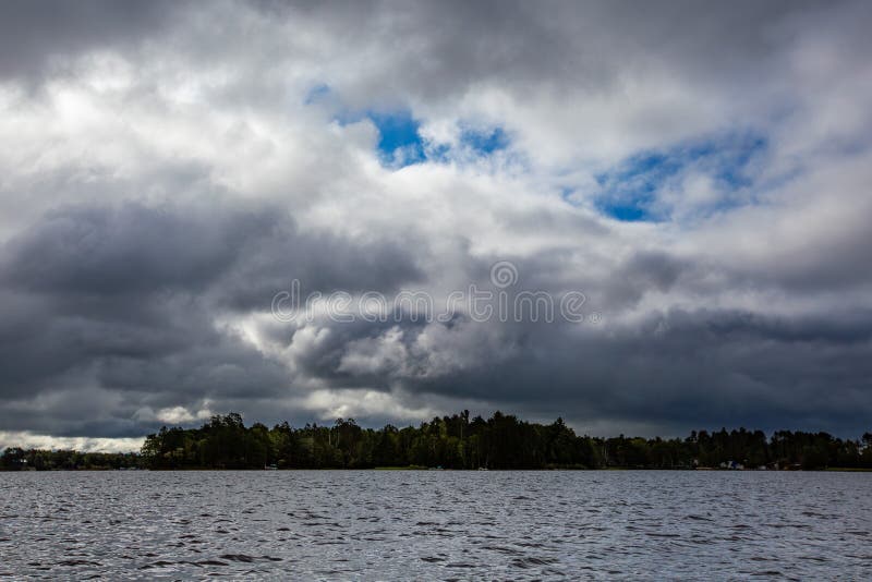 Cloudy, Dark Morning on a Wisconsin Lake in August Stock Image - Image ...