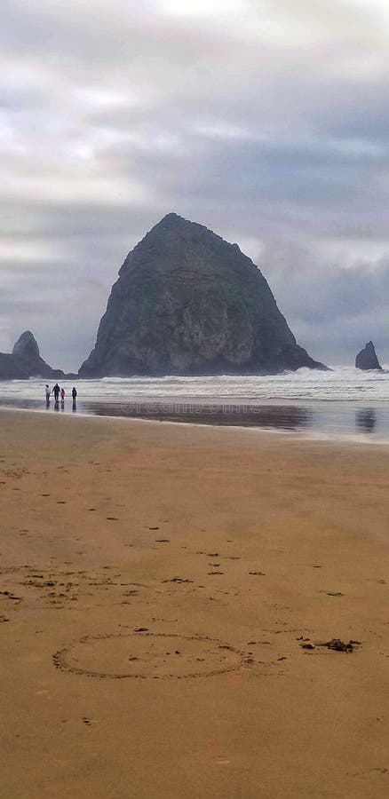 Cloudy day at the beach stock photo. Image of ocean - 160875442