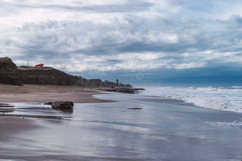 Cloudy day at the beach stock image. Image of landscape - 186092259