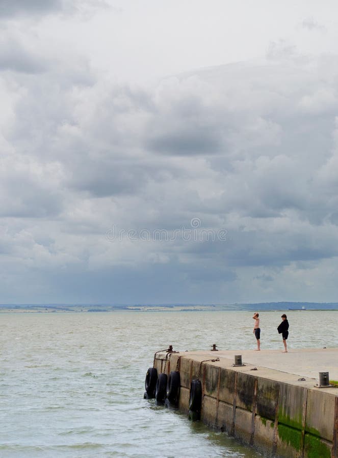 Cloudy Day at the Seaside with Children Editorial Photo - Image of ...