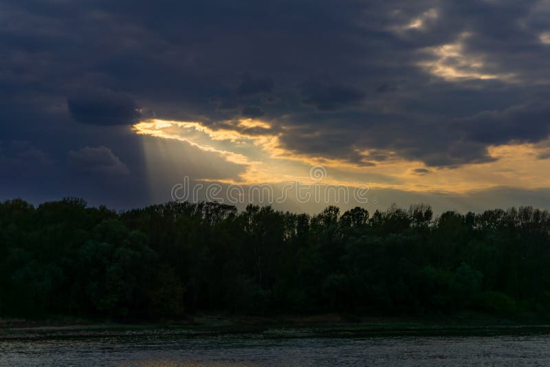 Cloudy Dramatic Sunset Over Water Stock Image - Image of color ...