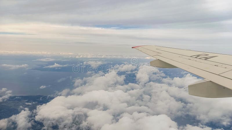 Cloudy Horizon in Haze Under the Wing of an Airplane Stock Image ...