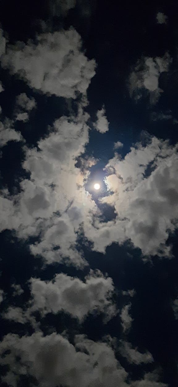 Cloudy night sky with moon stock photo. Image of night - 186570238