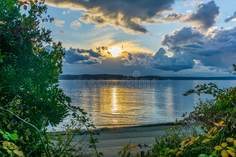 Cloudy Setting Sun stock image. Image of nature, reflection - 260886021