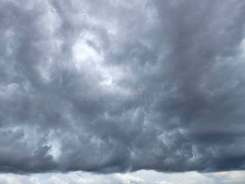 Cloudy Sky with Black Clouds Forming a Straight Line Stock Image ...