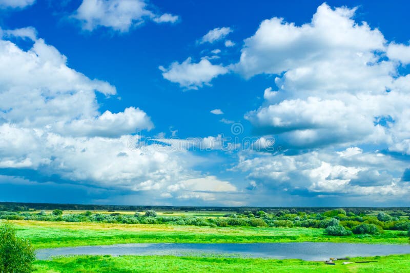 Cloudy sky and green field stock image. Image of scenery - 13227327