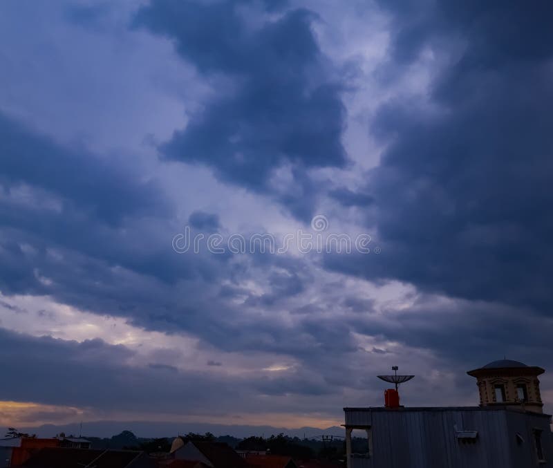 Cloudy Sky with Huge Building Stock Image - Image of cloudy, orange ...