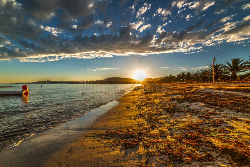 Cloudy Sky Over Alghero Shore at Sunset Stock Photo - Image of sand ...