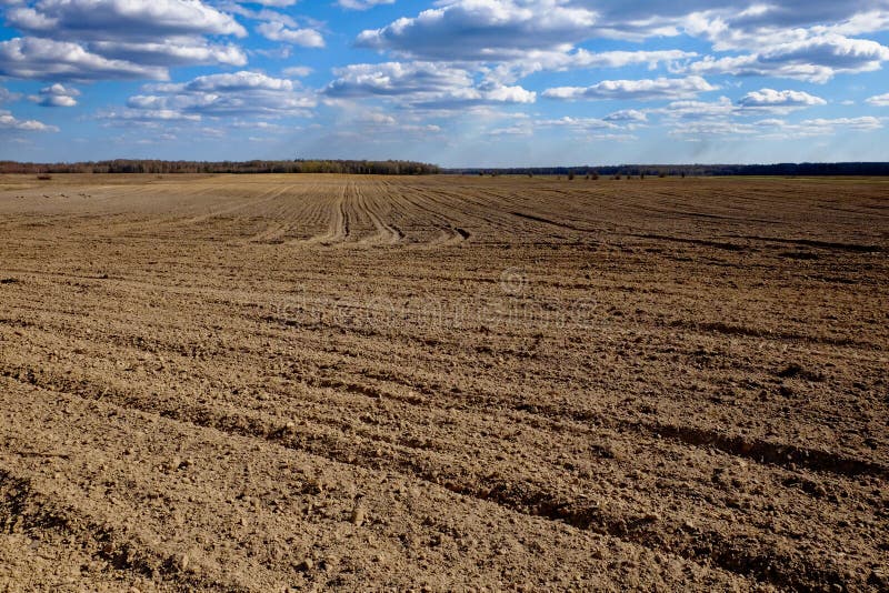 Cloudy Sky Over a Large, Empty, Plowed Field Stock Image - Image of ...