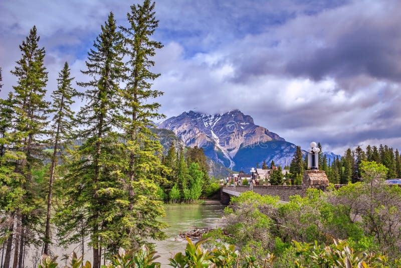 Cloudy Sky Over Mountains by Downtown Banff Stock Image - Image of ...