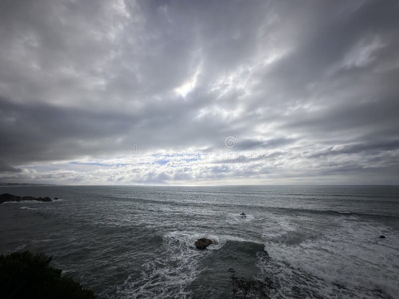 Cloudy Sky Over the Ocean from the Rocky Shore Stock Photo - Image of ...