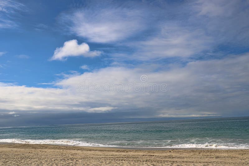 Cloudy Sky Over the Ocean and Sandy Beach Stock Image - Image of ...