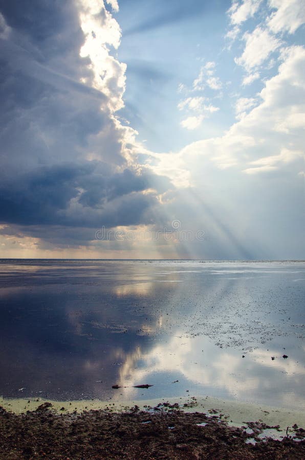 Cloudy sky over the sea stock image. Image of shore - 123673353