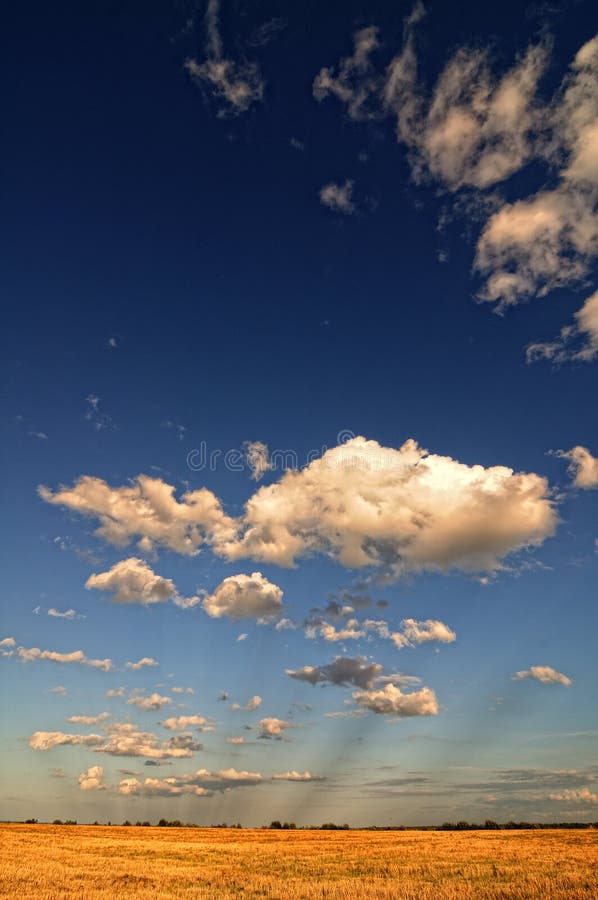 Clouds over the field. stock image. Image of natural - 123911473