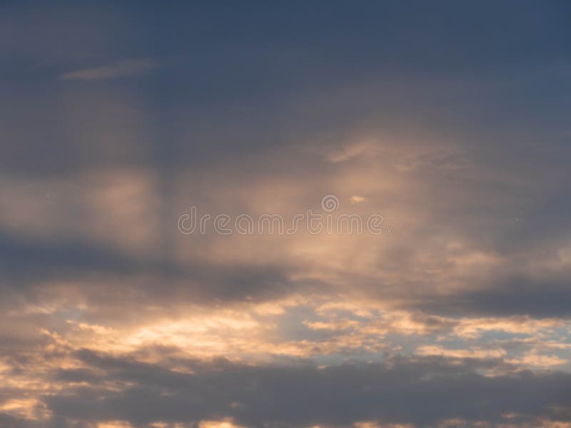 Sunlight Streaks from Behind the Clouds. Stock Photo - Image of break ...