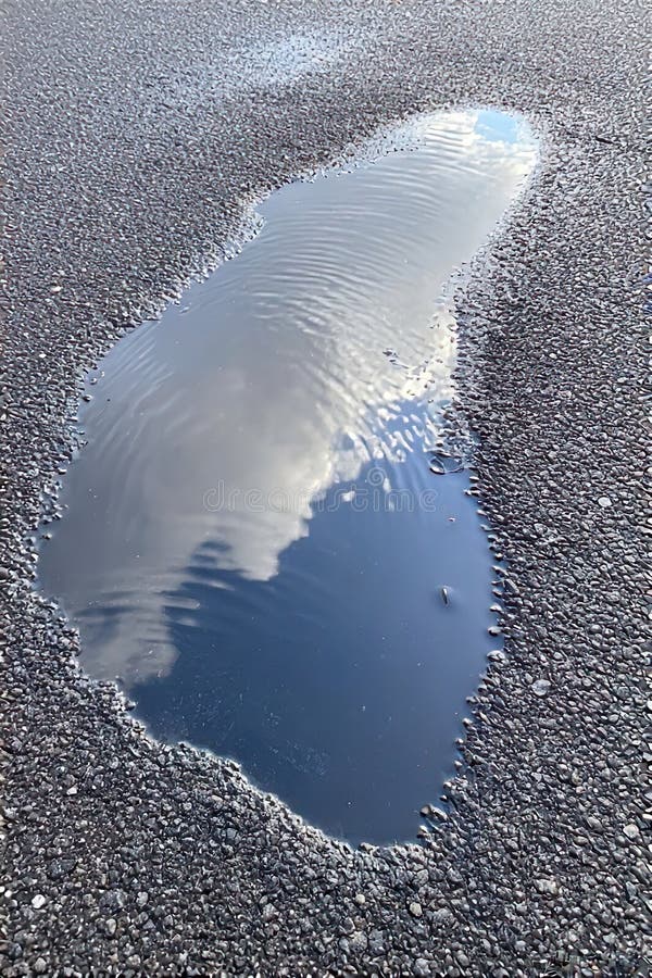 Cloudy Sky Reflected in Water Puddle Stock Illustration - Illustration ...