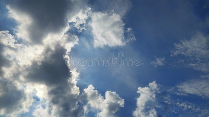 A Cloudy Sky Scene Featuring White and Grey Clouds, with a Hint of ...