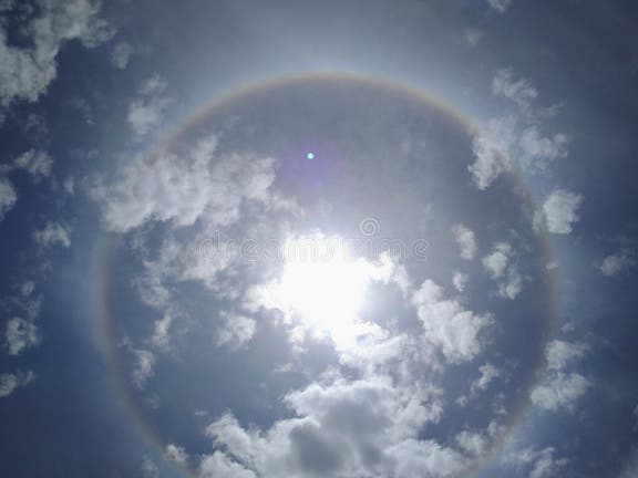 Cloudy sky and sun halo stock photo. Image of clustered - 265014758