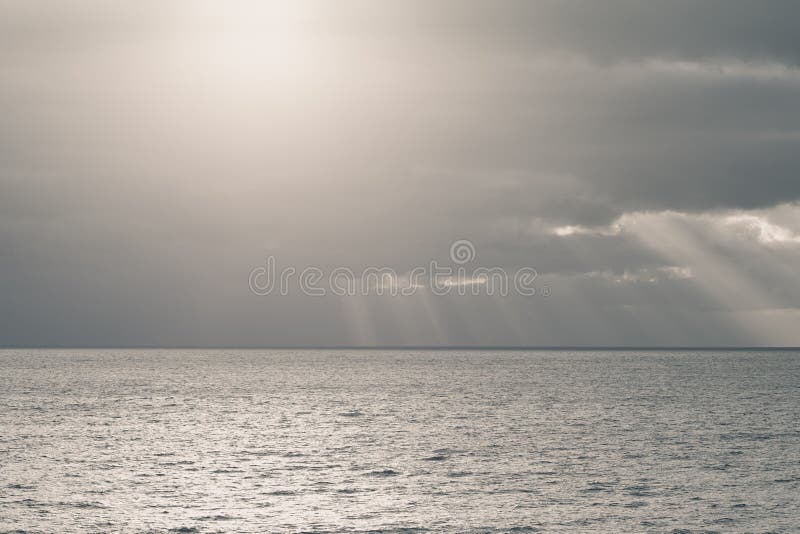 Cloudy Sky with Sun Rays in the Open Sea Stock Image - Image of cloudy ...