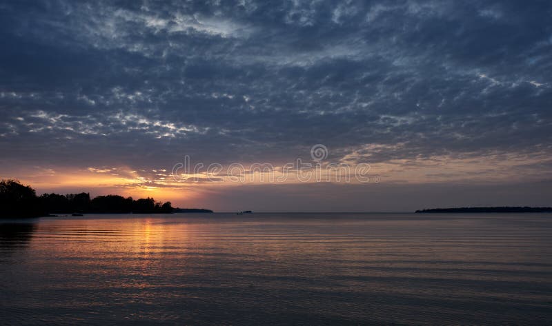 Cloudy Sky and Sunset Over the Water Stock Image - Image of yellow ...