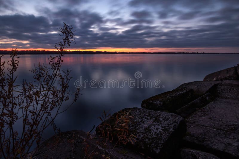 Cloudy Sky at Sunset is Reflected on the Water Surface of the River ...