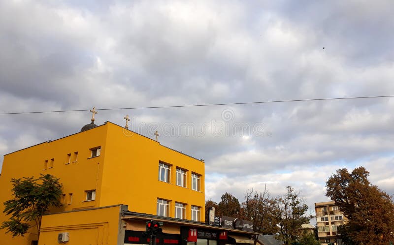 Cloudy Sky and Yellow Buildings Stock Photo - Image of building ...