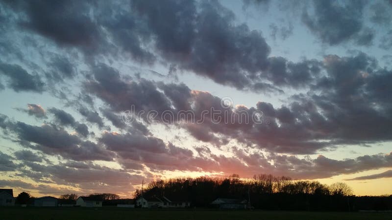 Cloudy storm @ sunset stock photo. Image of storm, beautiful - 97551408