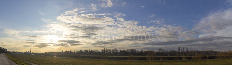 Cloudy sunrise scene stock photo. Image of grass, trees - 66123910
