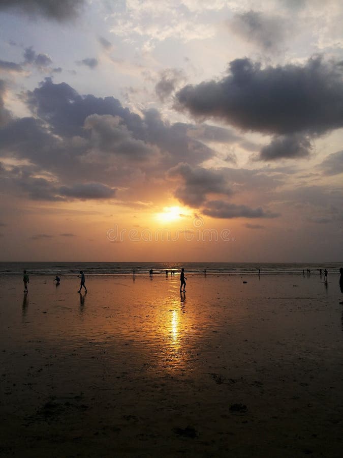 A Cloudy Sunset on the Beach Stock Photo - Image of sunset, dramatic ...