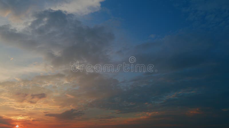 Cloudy Sunset Sky with Fluffy Clouds and Sun. Summer Sunset in Sky Haze. Timelapse. Stock ...